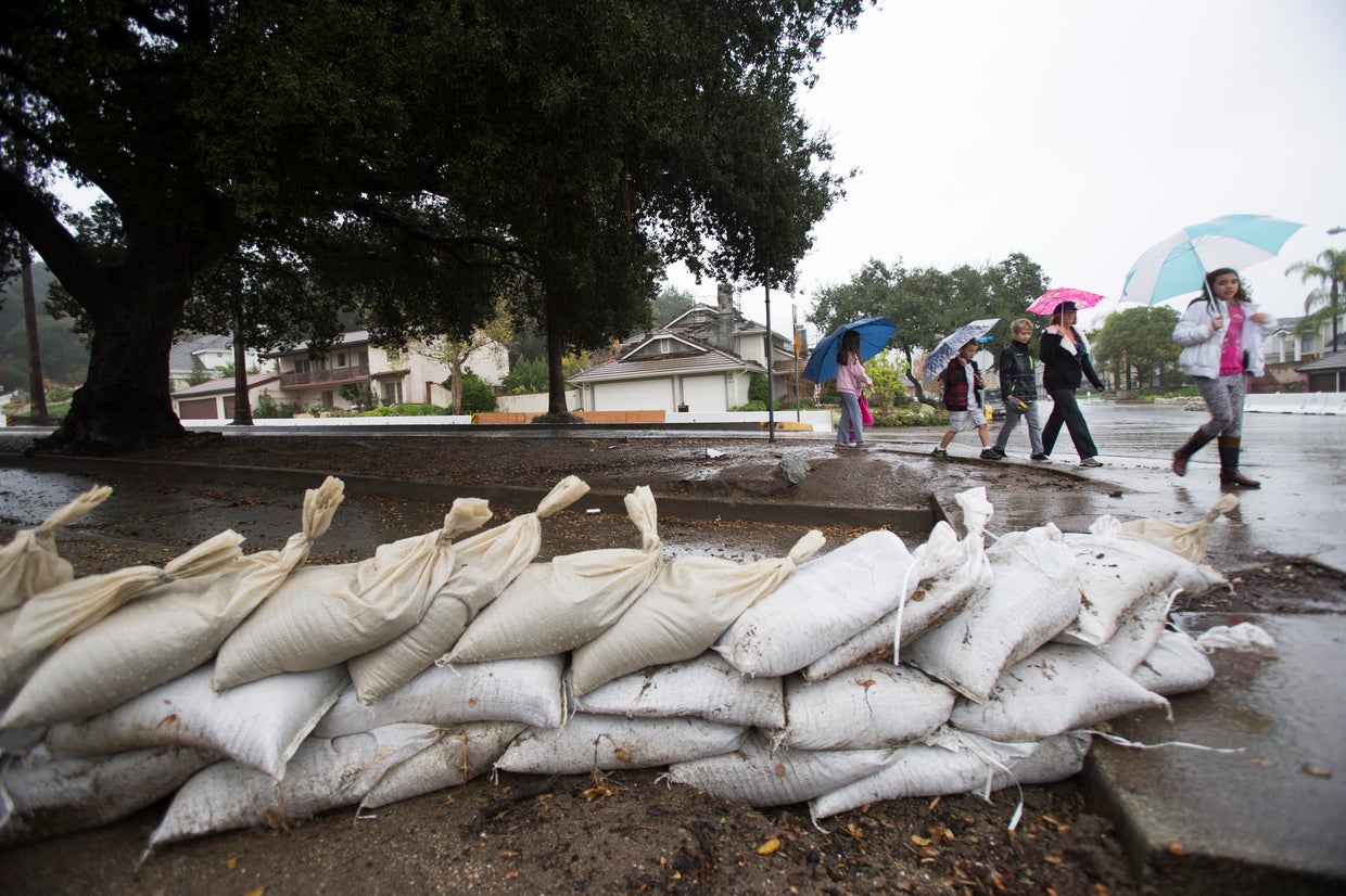 Heavy rain brings flooding, landslides to California - CBS News