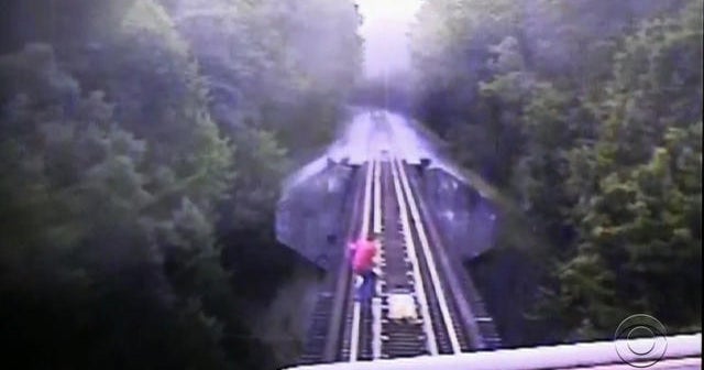 Women survive after being run over by train - CBS News