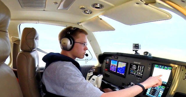 Teen pilot breaks record for flying around the globe - CBS News
