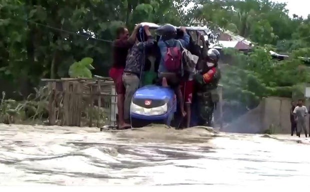 Cyclone kills almost 100 as floods, landslides hit Southeast Asia - CBS ...